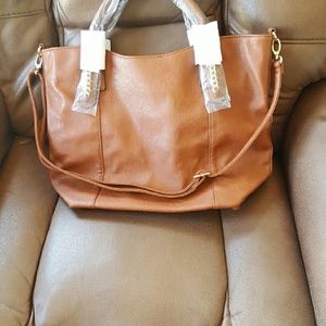 56% off JustFab Handbags - Brand new. Large black purse. from Nikita's ...